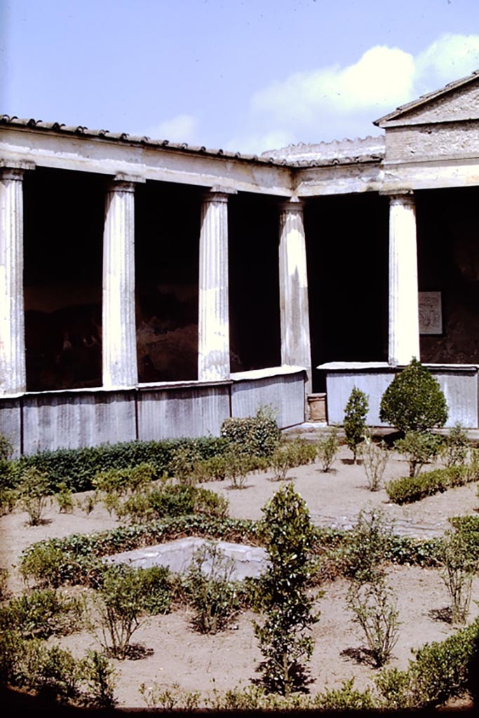 I.10.4 Pompeii. 1968. North-west corner of peristyle garden with covering over pluteus to try ...